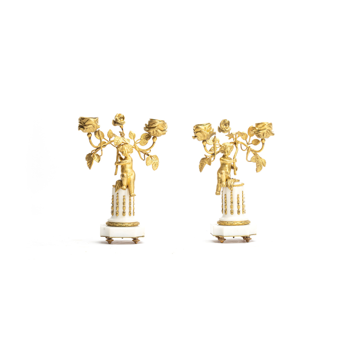 A cute pair of romantic small candlesticks featuring two small kids ...