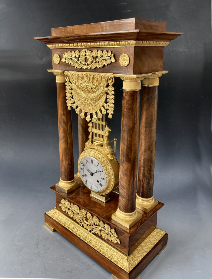 A French mahogany ormolu mounted portico mantel clock with oscillating ...
